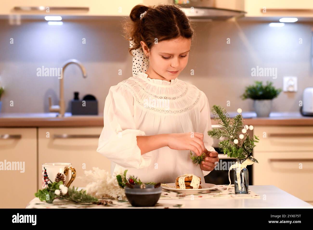 The image shows a girl decorating a table for a holiday table Stock ...