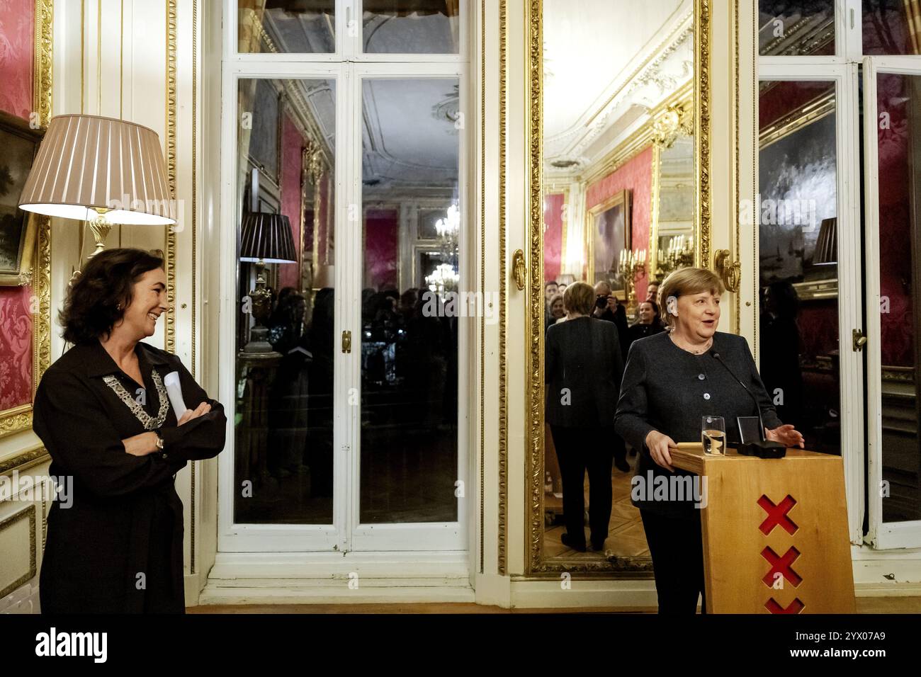 AMSTERDAM - Former Chancellor Angela Merkel (r) speaks after receiving ...