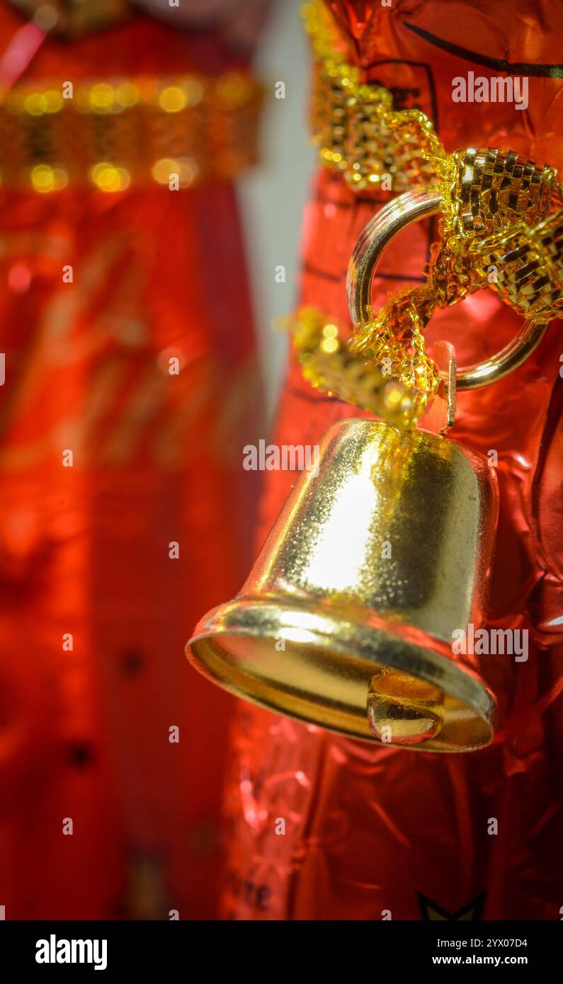 Macro shot of a Christmas bell on the hip of a Santa Claus costume ...