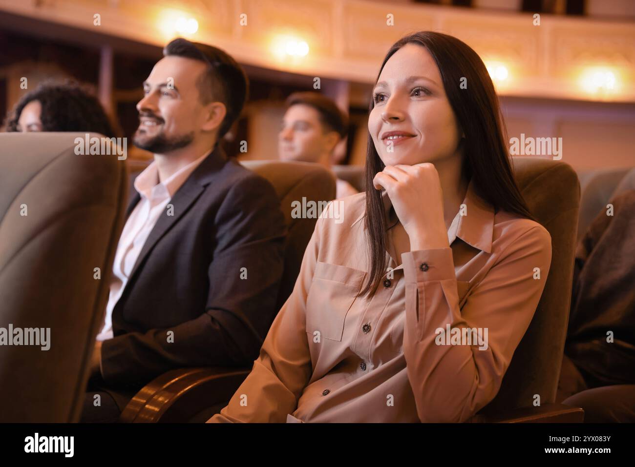 Group of people watching theatrical performance in theatre Stock Photo ...
