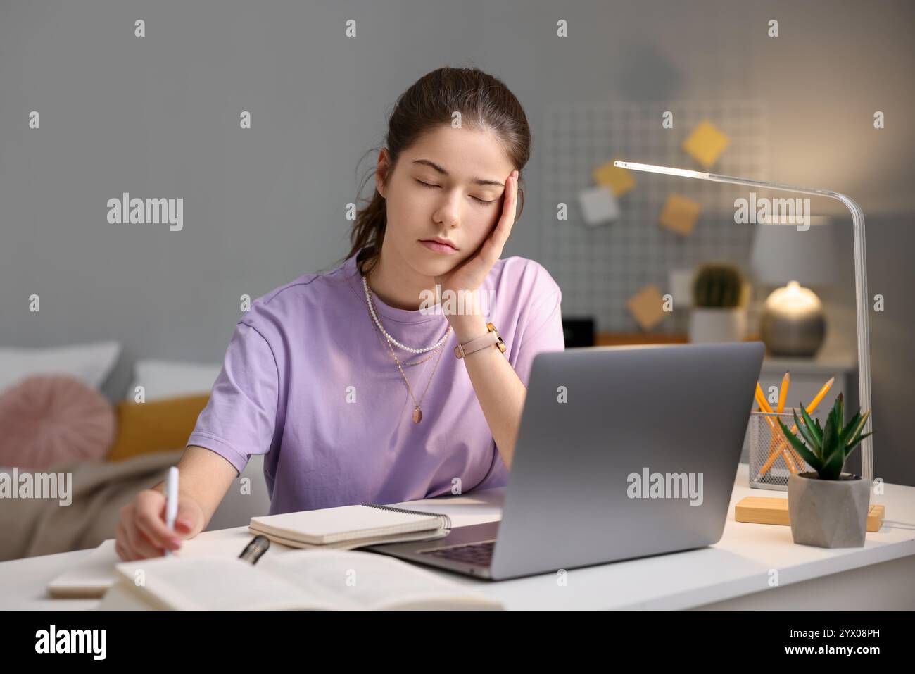 Preparing for exam. Tired student sleeping at table indoors Stock Photo ...