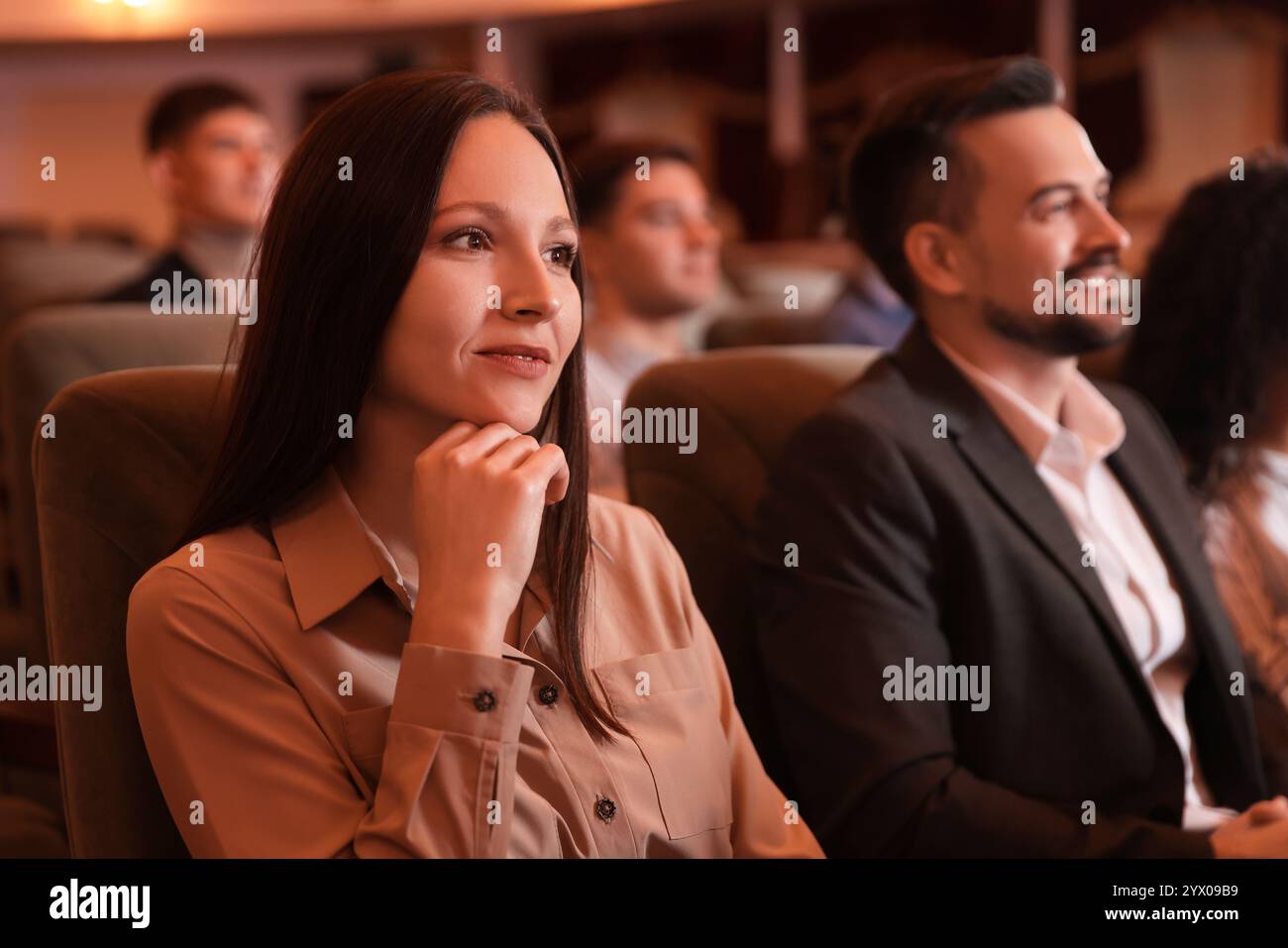 Group of people watching theatrical performance in theatre Stock Photo ...