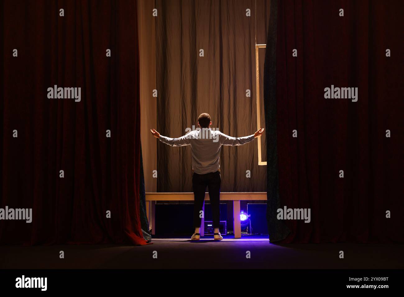 Professional actor rehearsing on stage in theatre, back view Stock ...