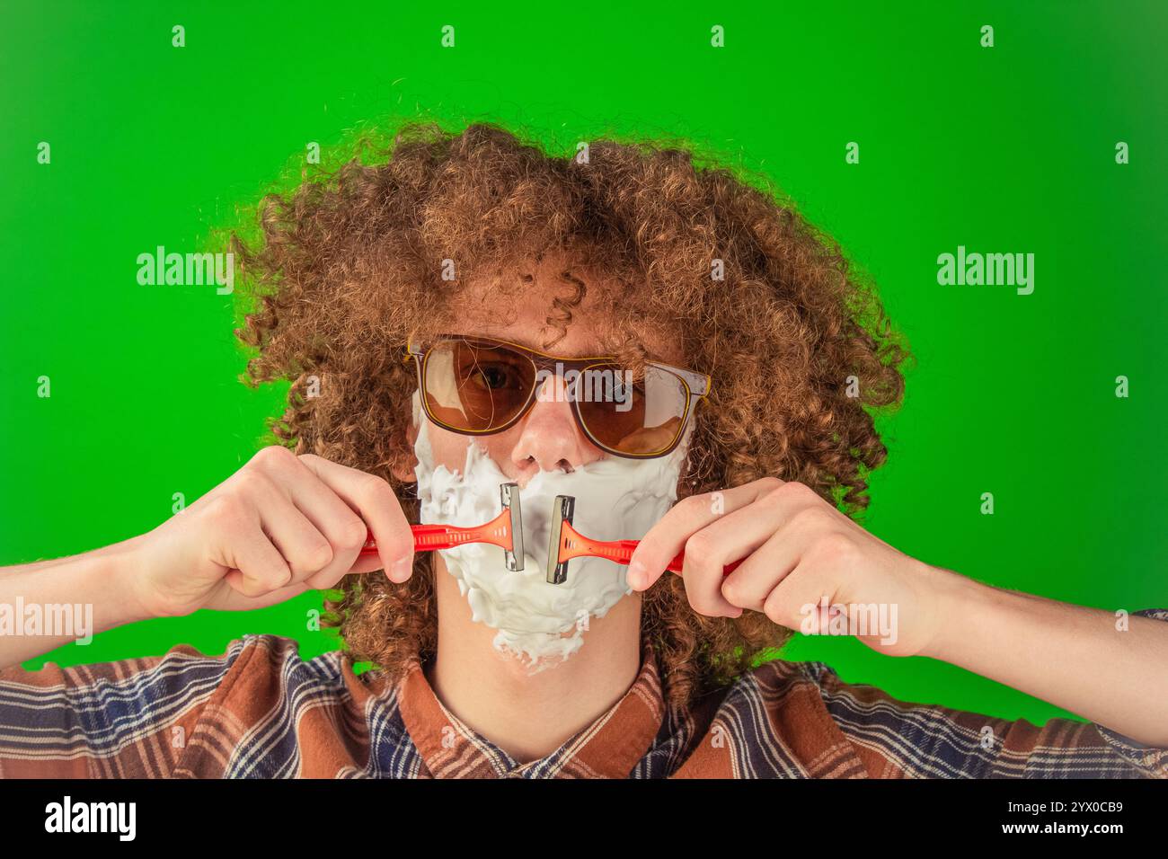 Dressed in formal attire, the curly-haired boy with glasses applies ...