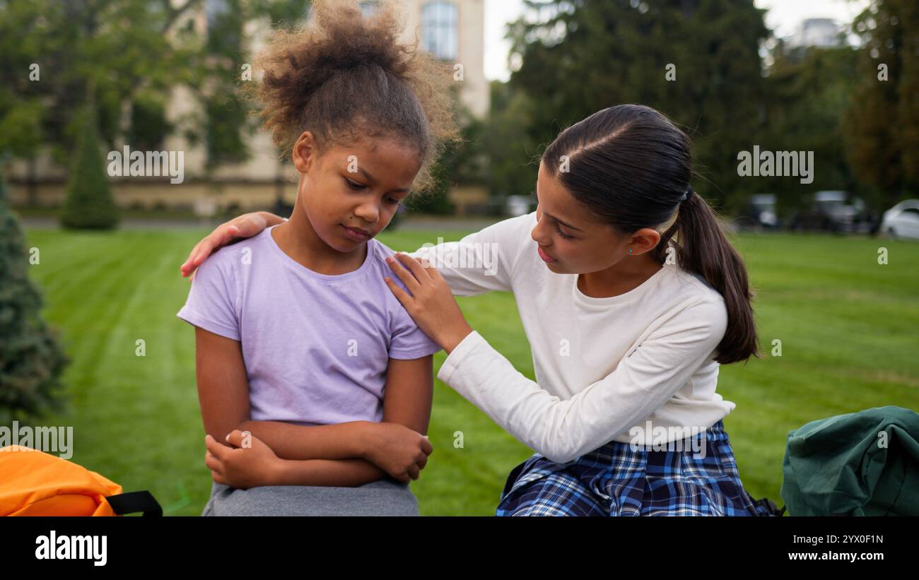 Friends quarrel two little girls African American children sisters ...