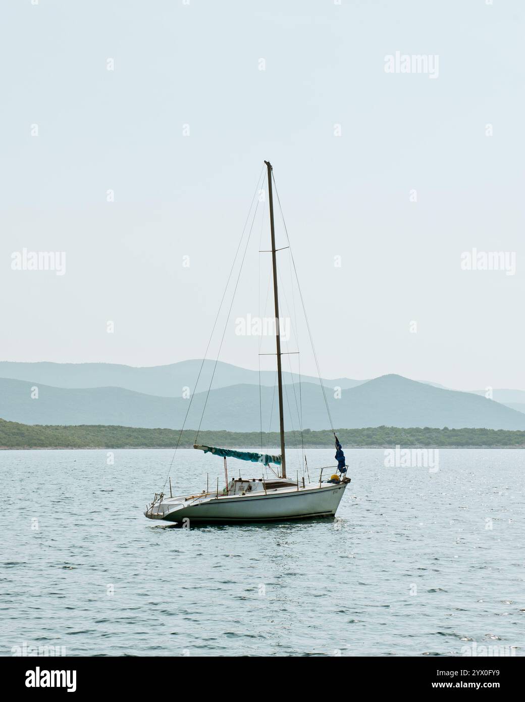 Boat anchored on beach waves hi-res stock photography and images - Alamy