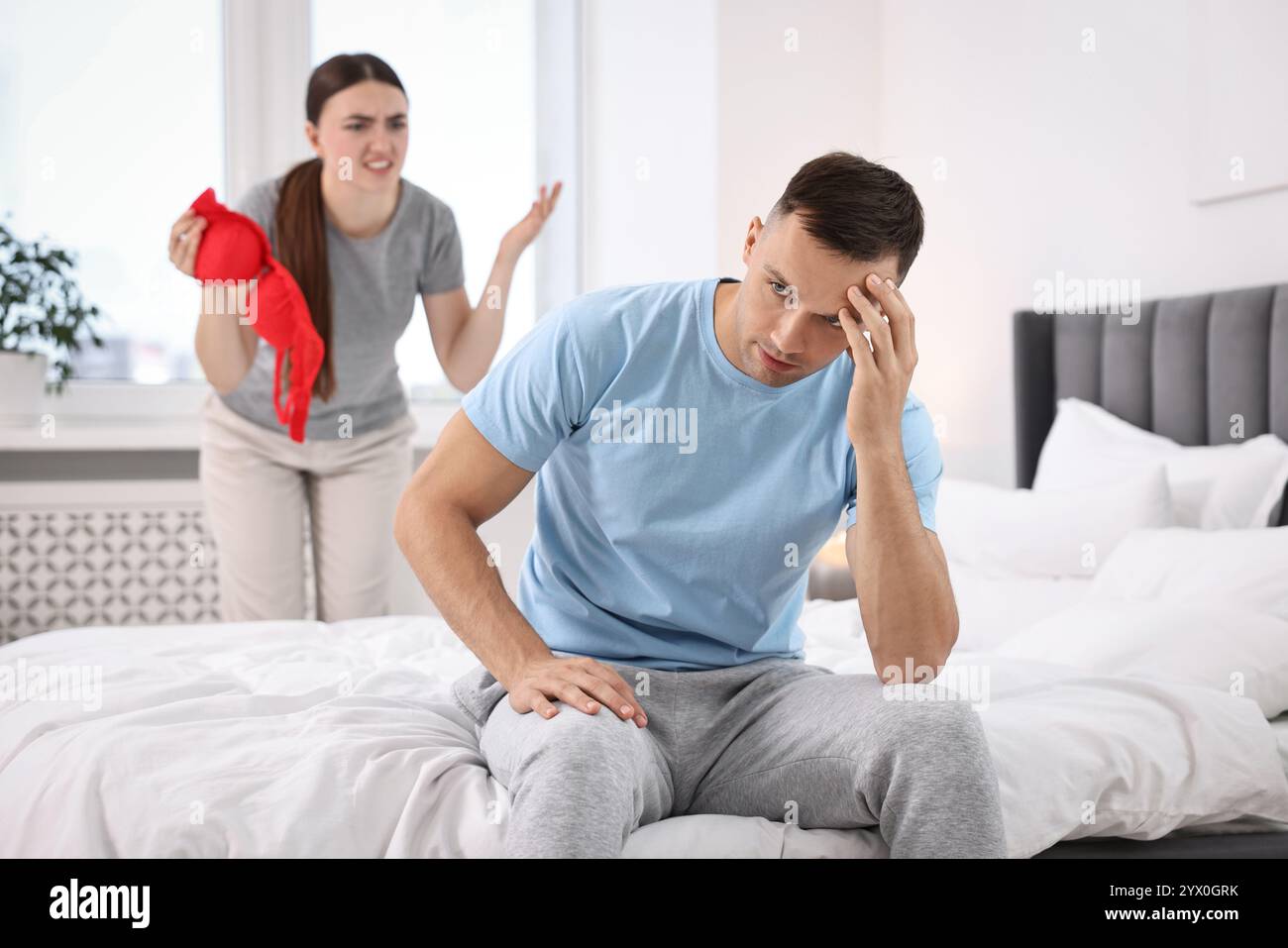 Angry wife showing mistress bra as proof to her unfaithful husband ...