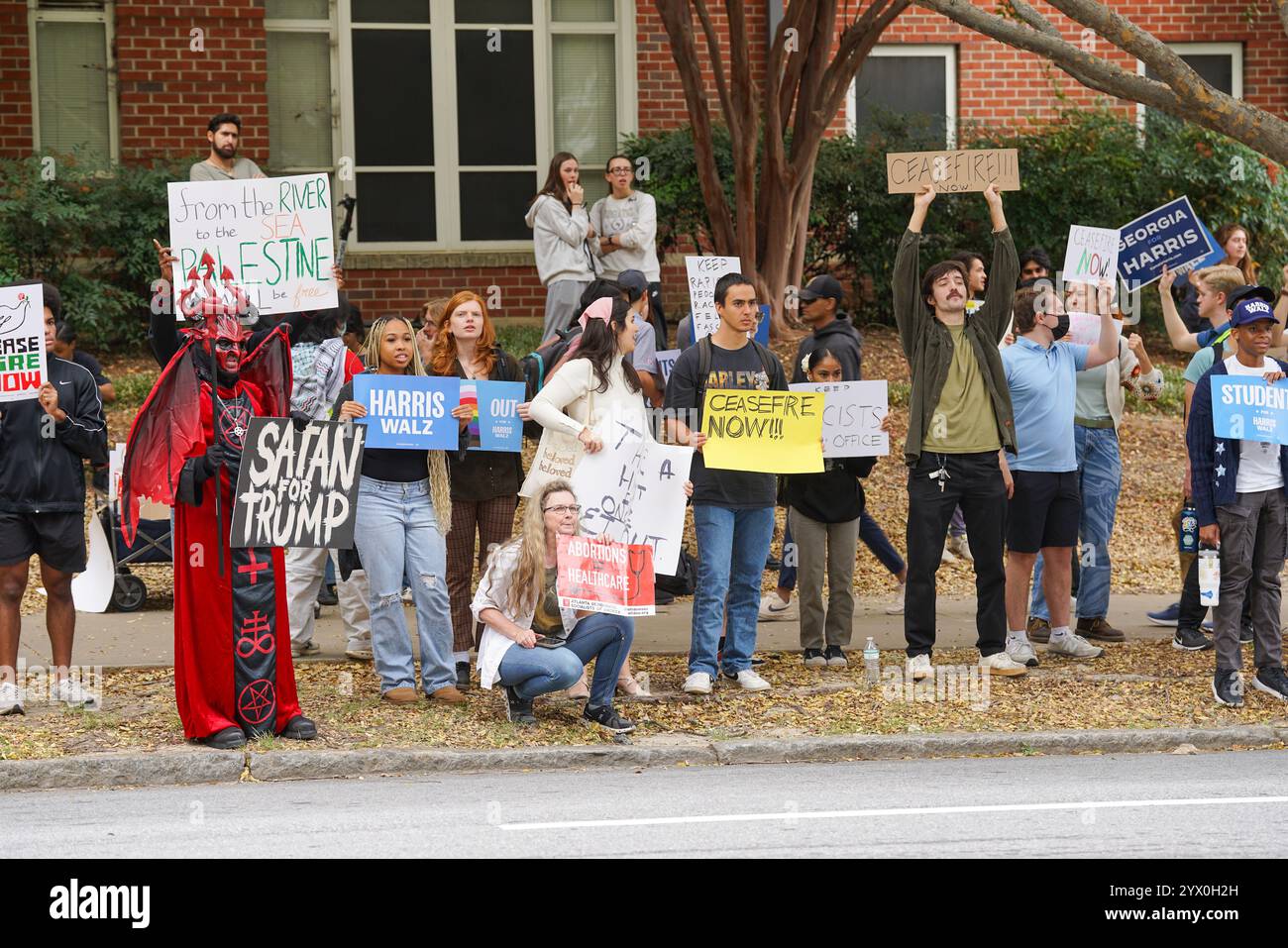 A demonstrator wearing a "Satan For Trump" costume protests outside a ...