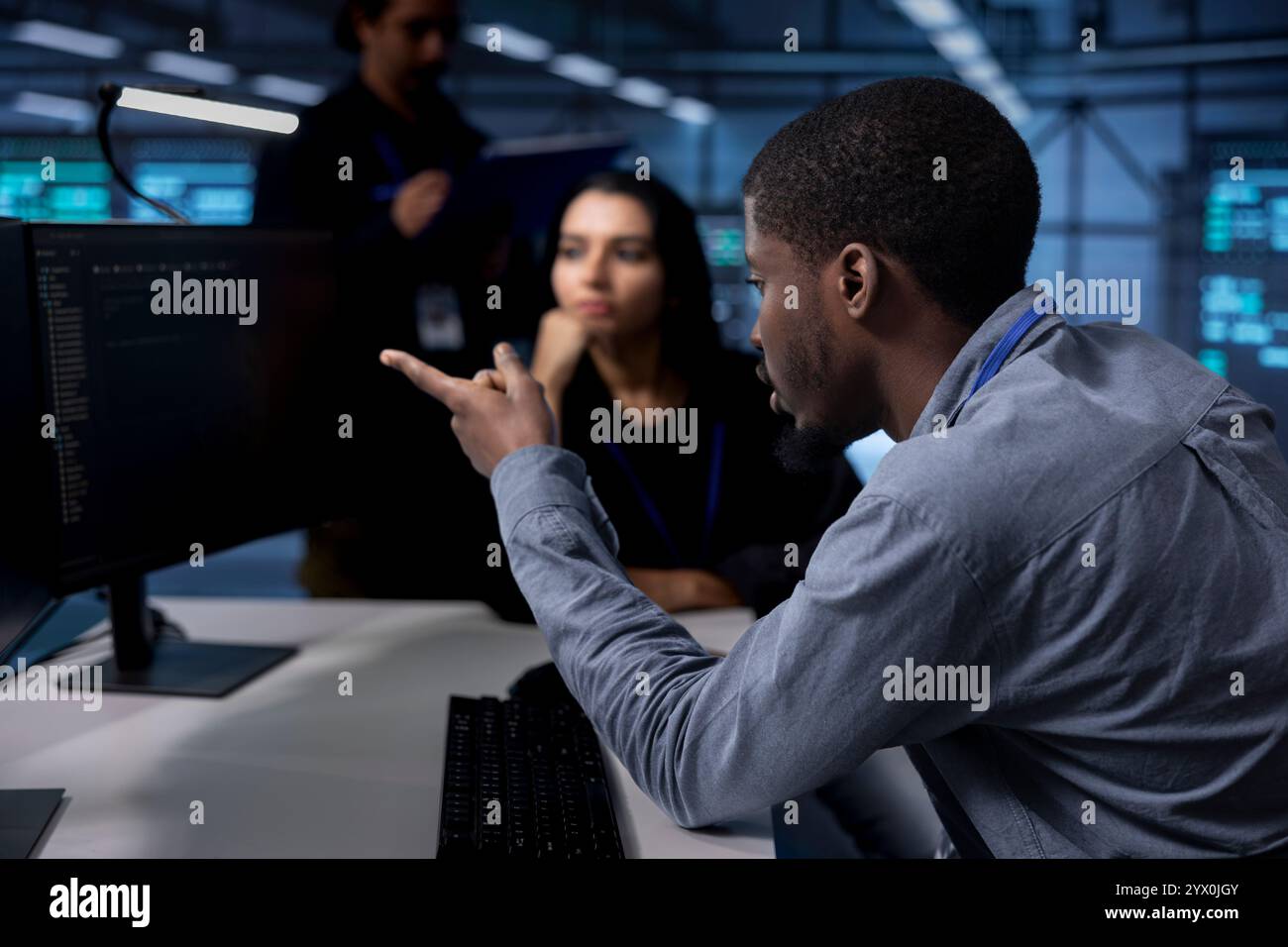 Multiethnic Team Reconfiguring Server Farm To Optimize It For Data