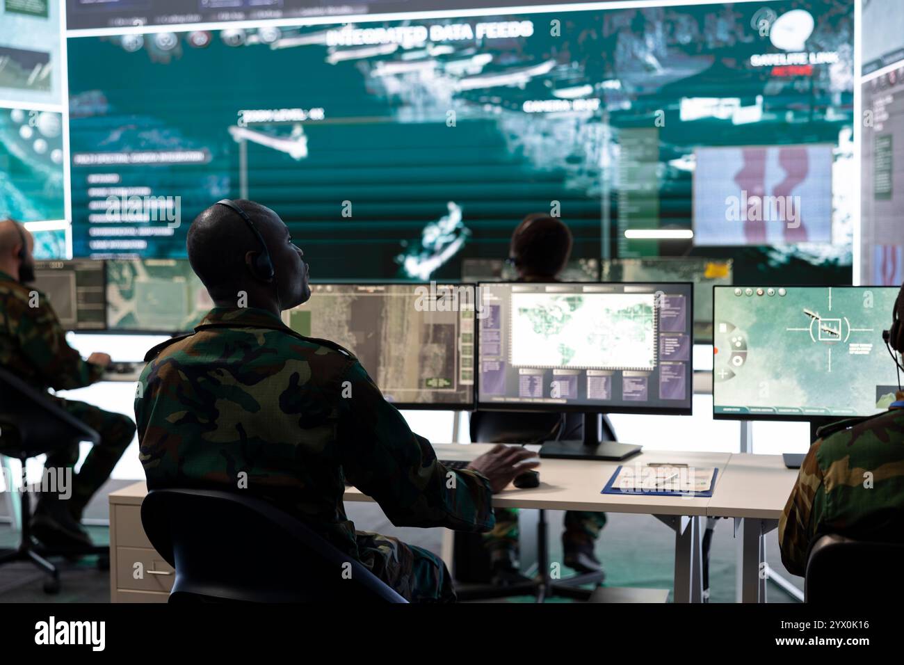 Military personnel examining surveillance footage captured by CCTV ...