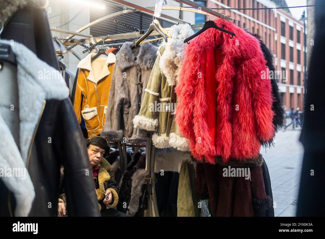 London, UK, December 1, 2024, A vintage fur coat seller at Spitalfields ...