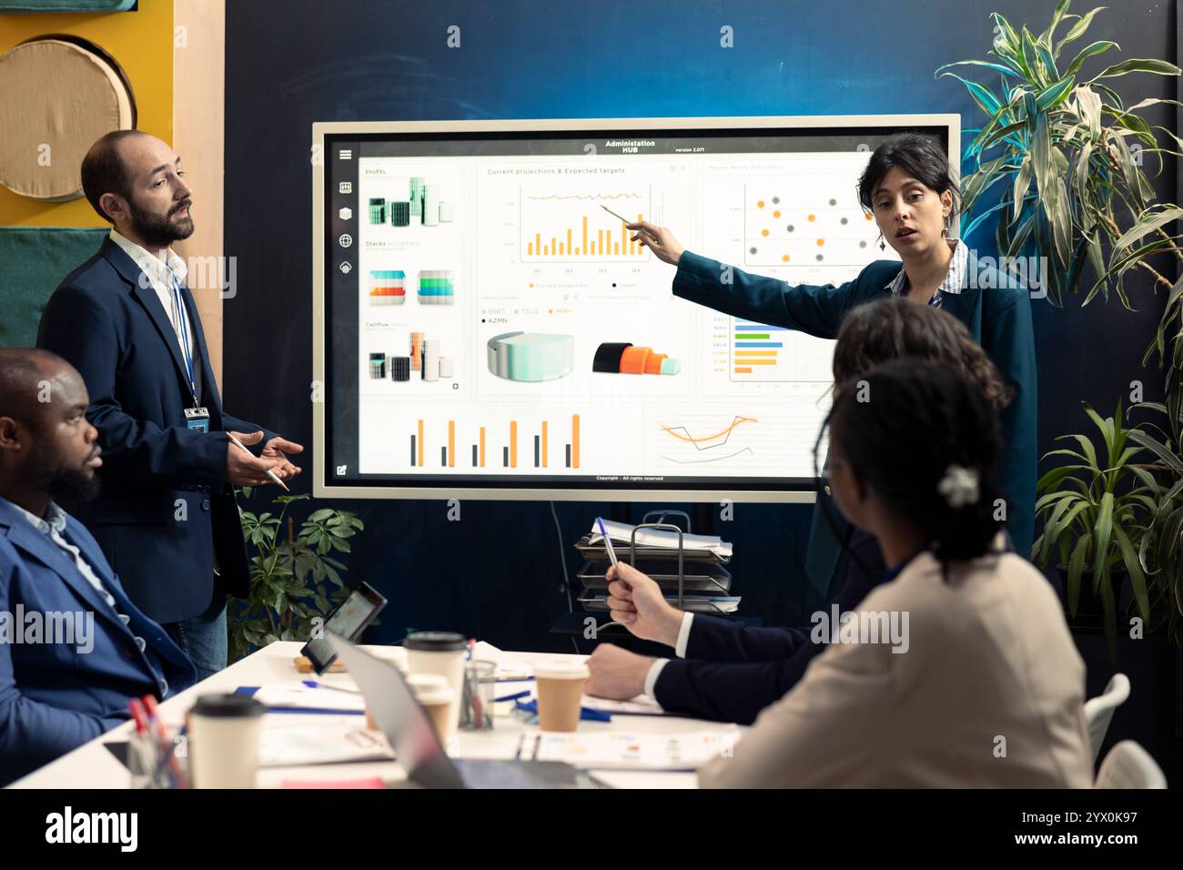 Business consultant making a pitch presentation with annual data ...