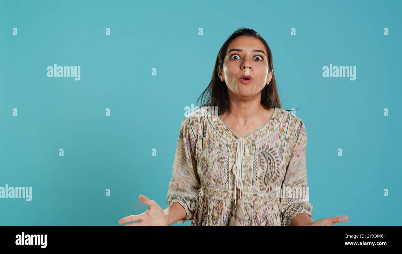 Portrait of joyful indian woman celebrating, showing positive emotions ...