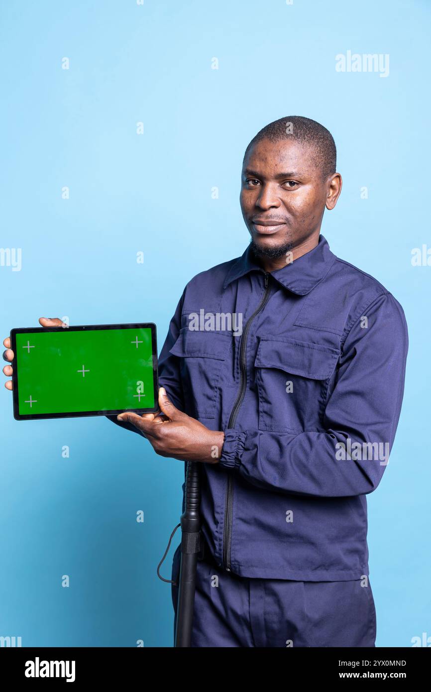 Happy proud african american security guard uses mockup screen in ...