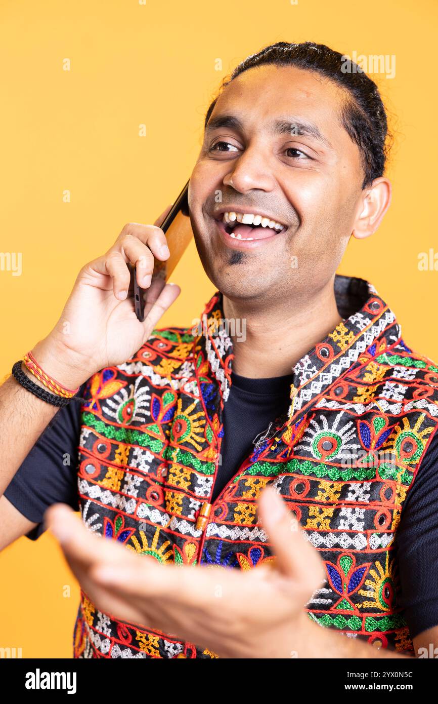 Happy man cracking jokes with best friend over telephone call using ...