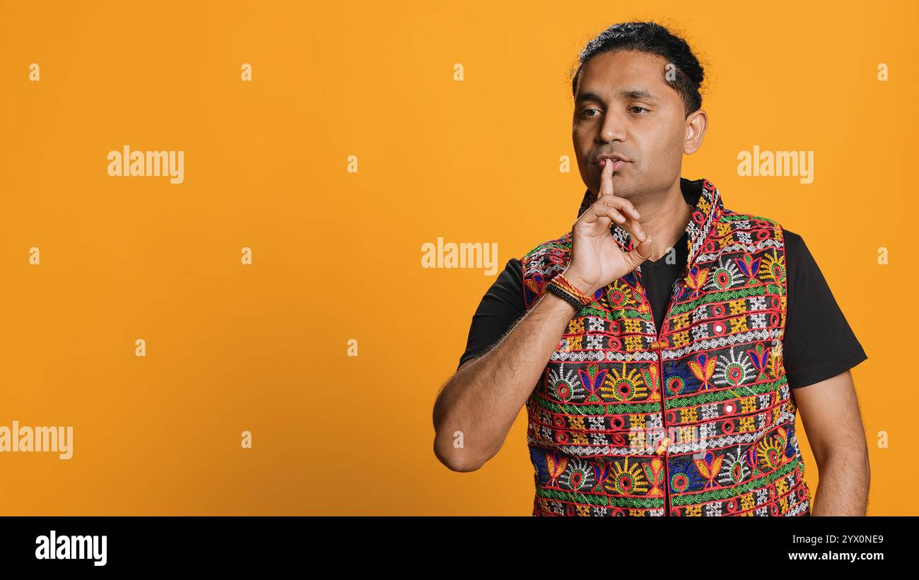 Annoyed indian man doing shushing hand gesturing, irritated by noise ...