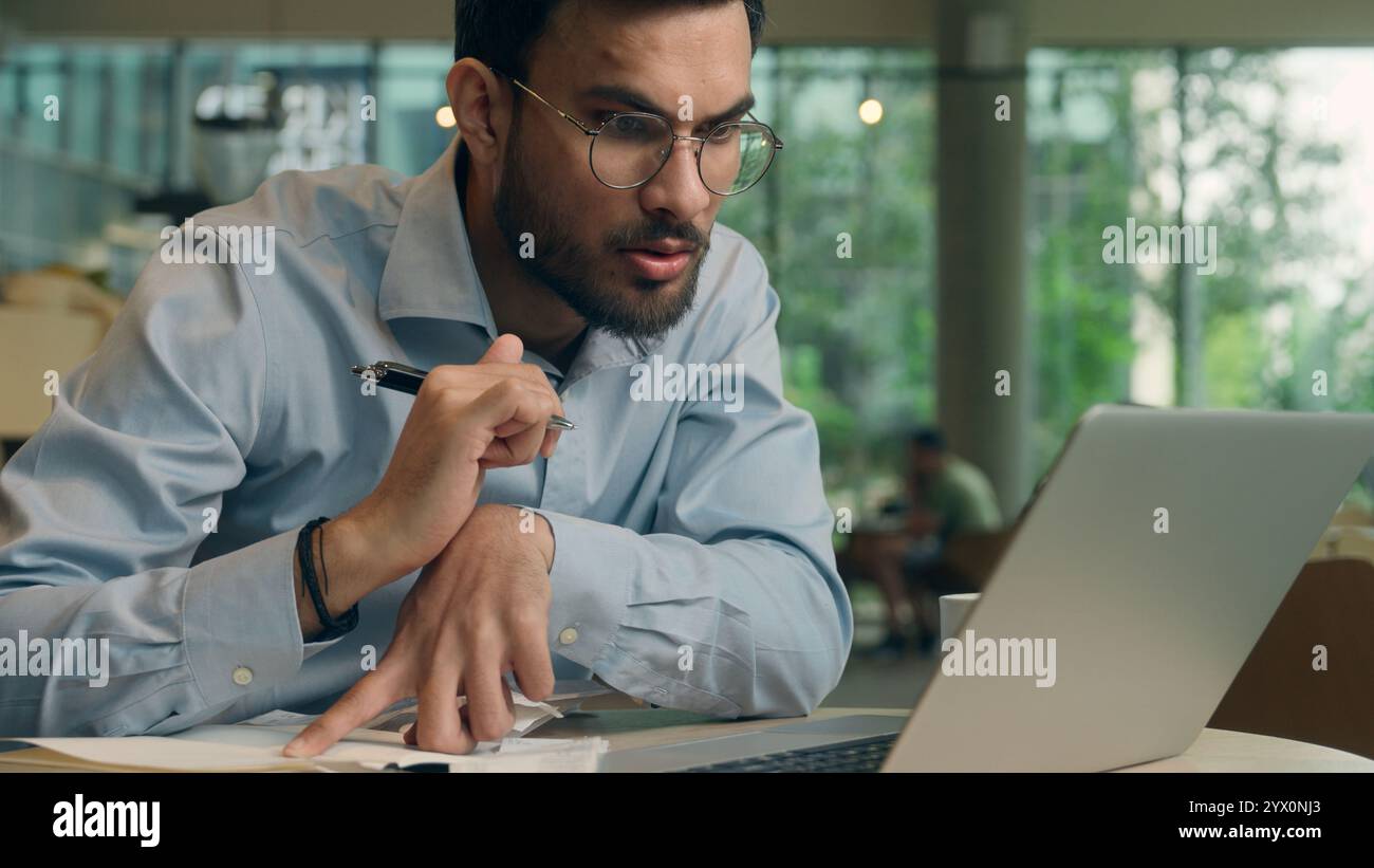 Arabian Indian business man guy education studying write notes in cafe ...