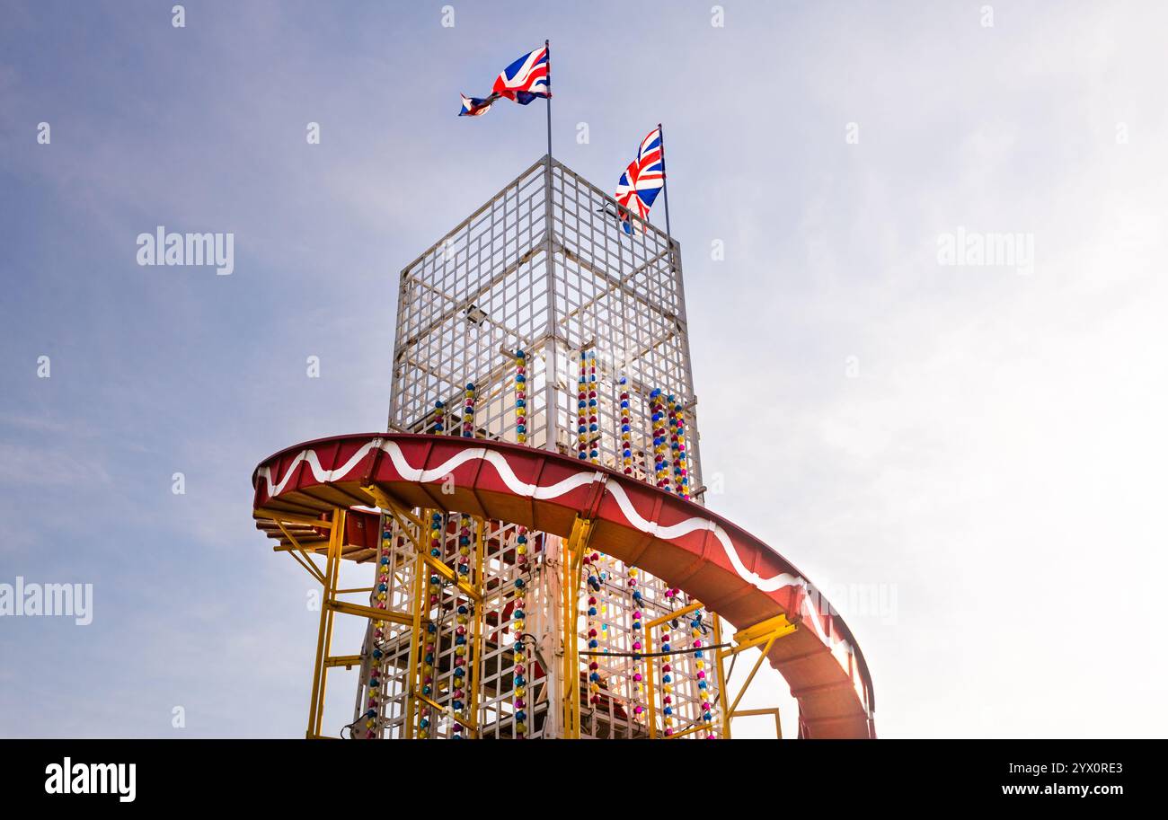Helter Skelter slide ride at British carnival funfair with British ...