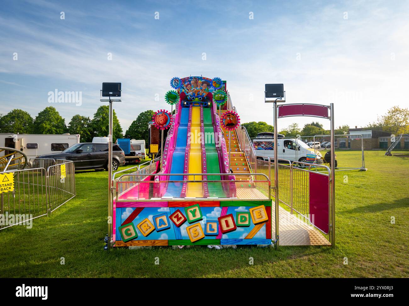 Large multi-coloured plastic slide at traditional British funfair in ...