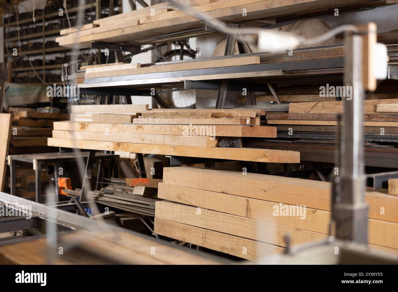 Stacks of wood planks in lumberyard. Timber planks stacked to season ...