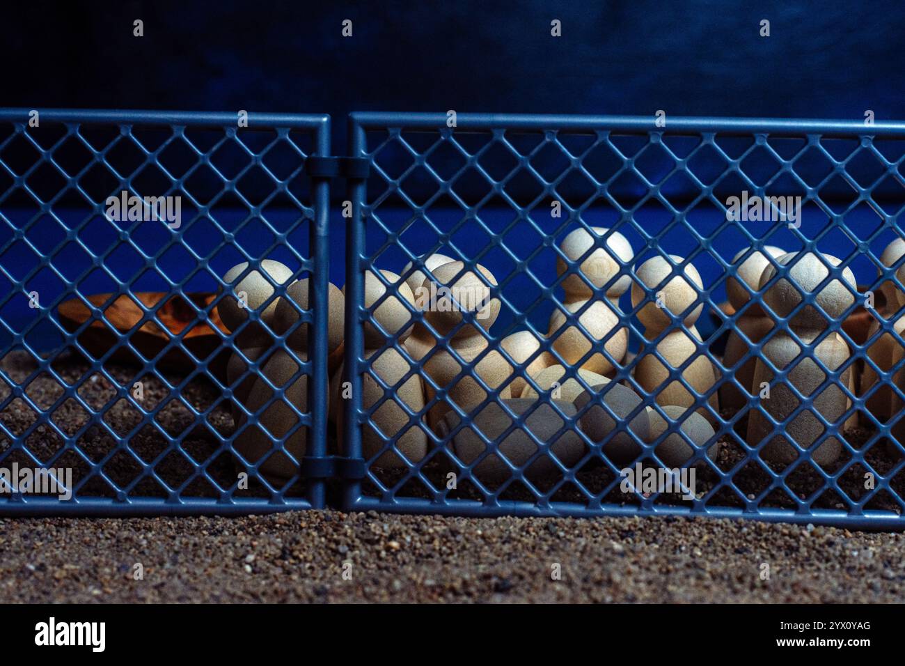 Wooden Figures Crowded Behind a Fence, Migration Symbolism Stock Photo ...