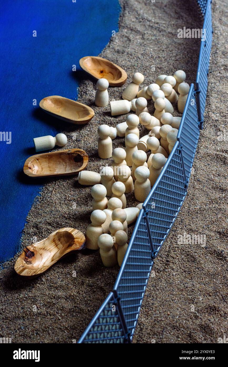 Wooden Figures and Boats Near a Border Fence, Migration Symbolism Stock ...