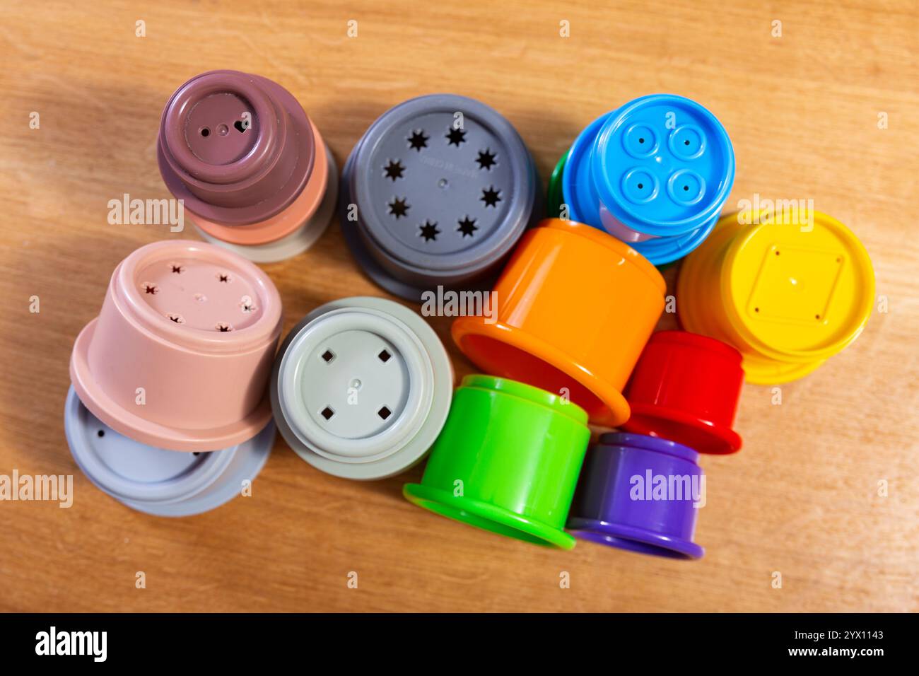 Childrens toy plastic cup pyramid made of multicolored elements Stock ...