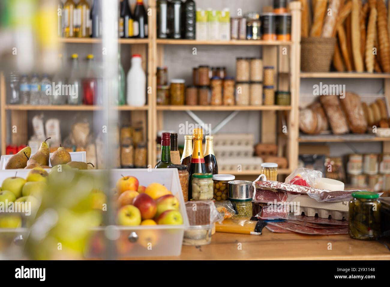 Different foods and drinks on grocery store counter Stock Photo - Alamy