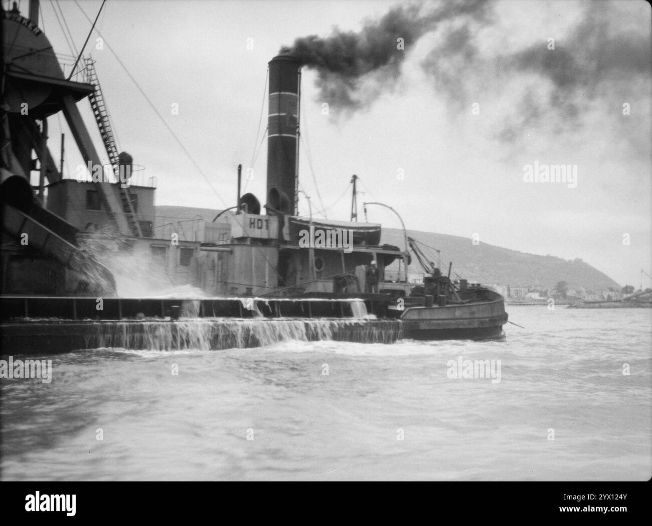 Construction of the Haifa harbour. Dredger in the Haifa harbour. Hard ...