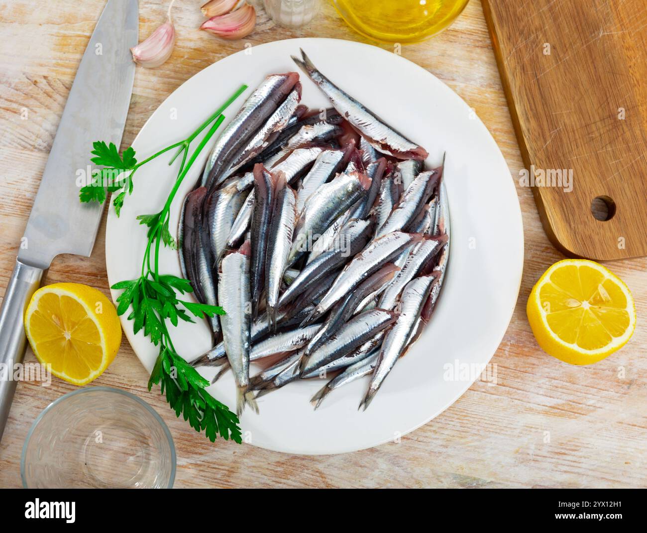Pile of small raw fish is piled on plate, ready for frying Stock Photo ...