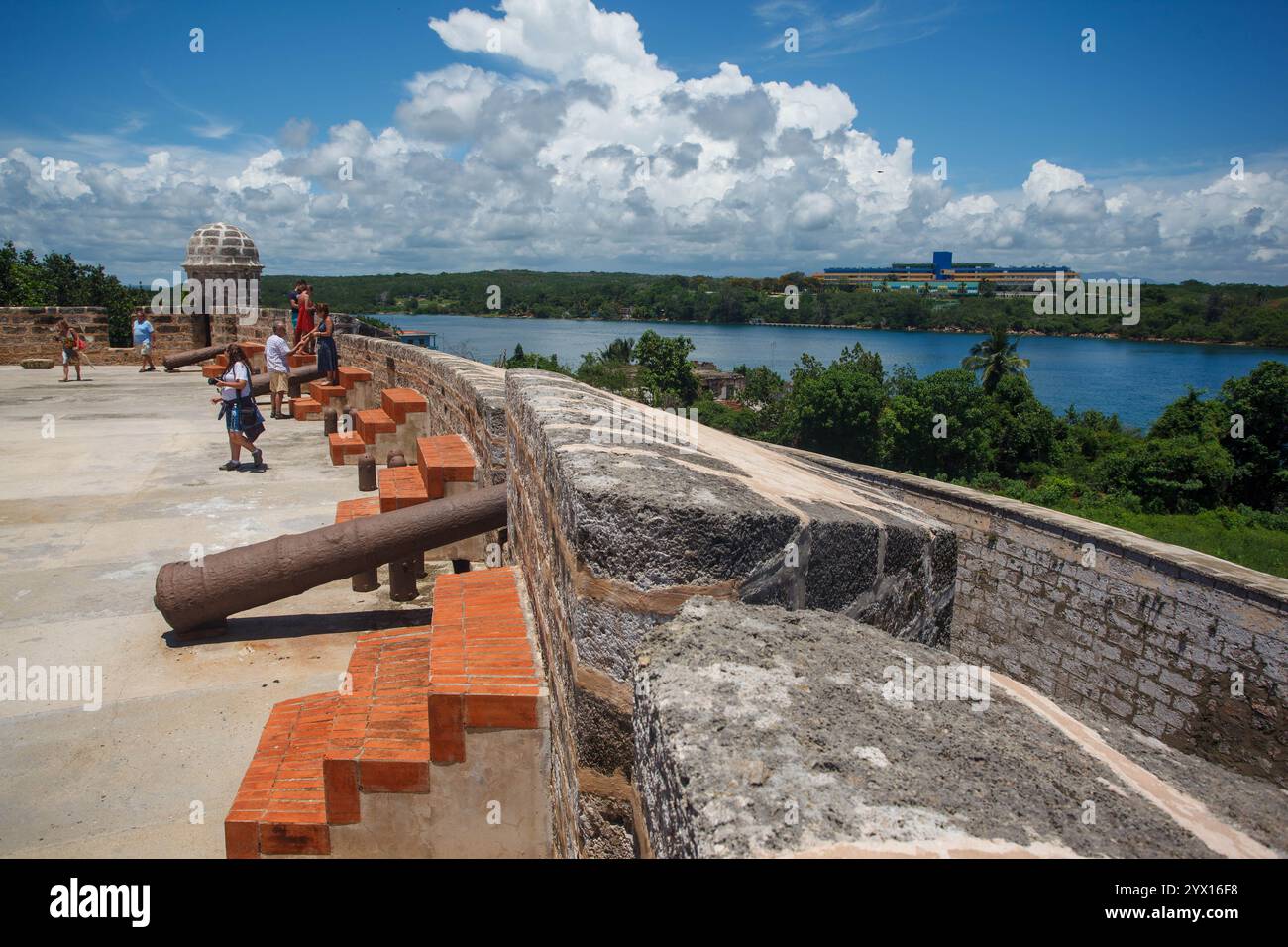 Castillo de Jagua fortress, two cannons, a turret and Hotel Pasacabllo ...