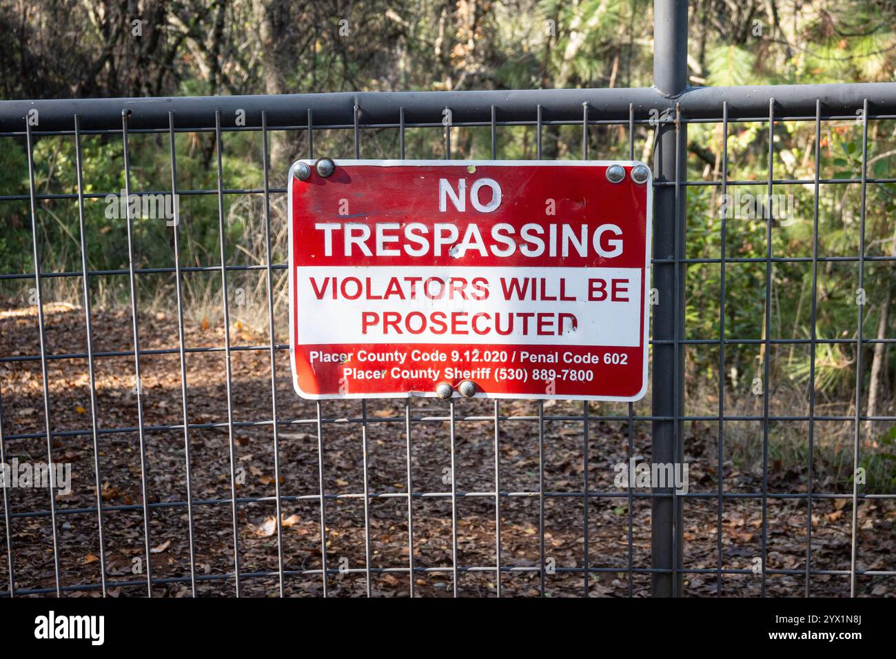 Placer County No Trespassing red sign on a gate at Hidden Falls ...