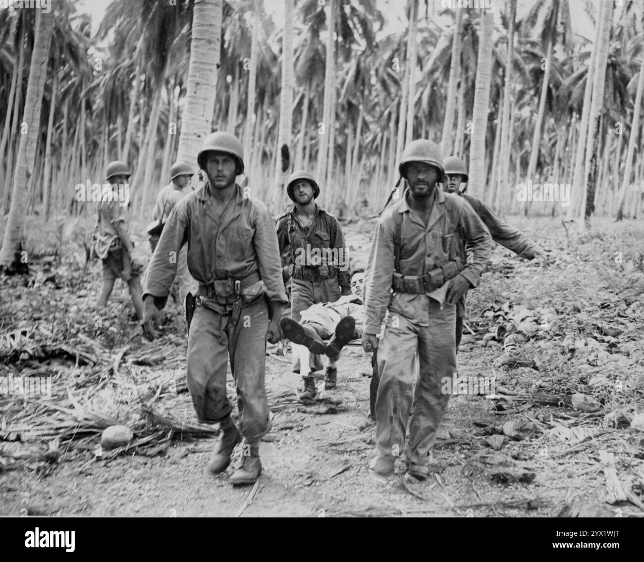 Corpsmen carry a casualty to safety under heavy sniper fire Guadalcanal ...