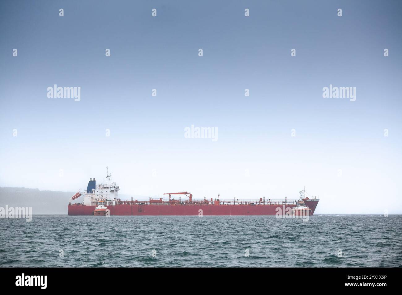 Selective blur on a red oil tanker navigates Koper’s port in slovenia ...