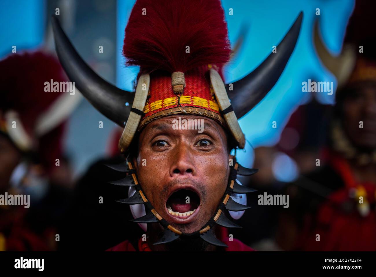 An Indigenous Naga man sings during the Hornbill Festival in Kisama, on ...