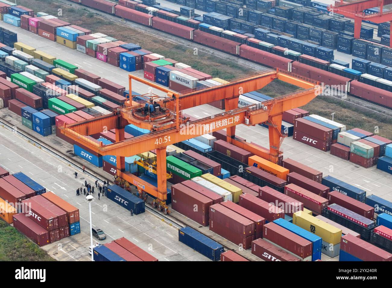 Cranes load import and export cargo containers at the Nanchang ...