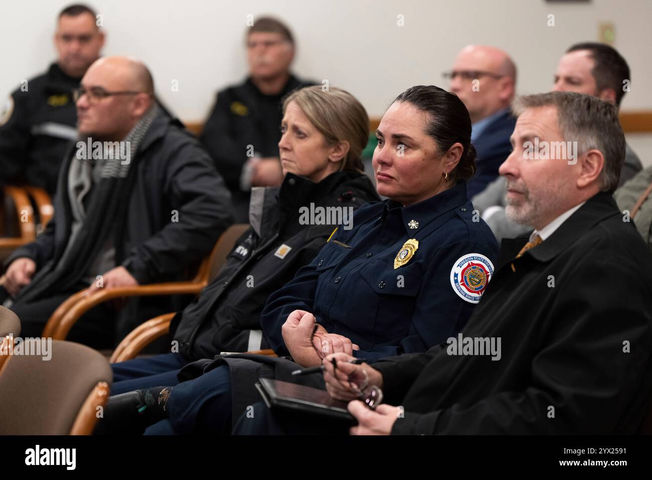 Oregon Fire Marshal Mariana Ruiz-Temple, second from right, listens ...