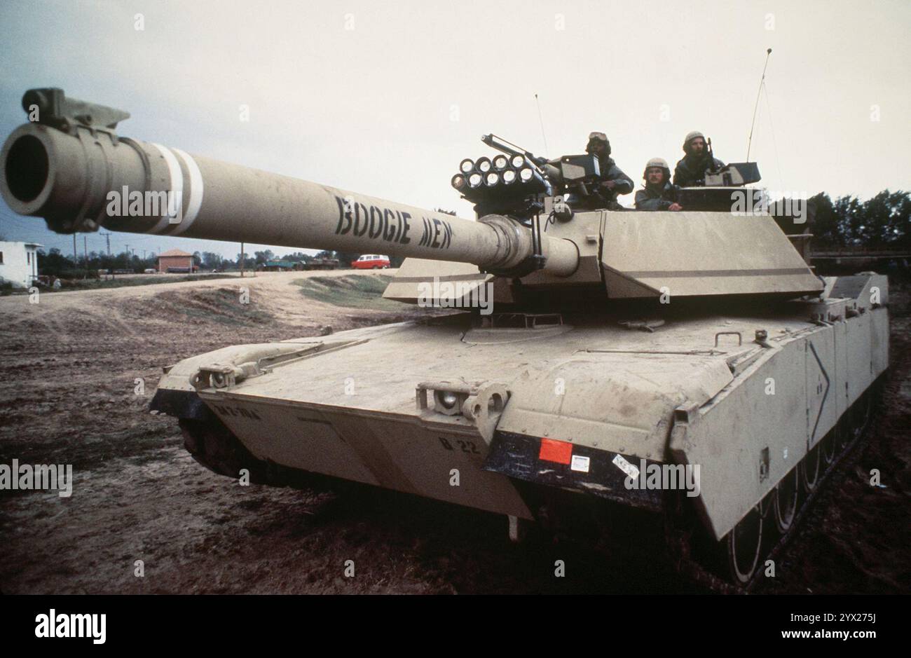Crewmen stand by in an M-1 Abrams main battle tank from the 24th ...