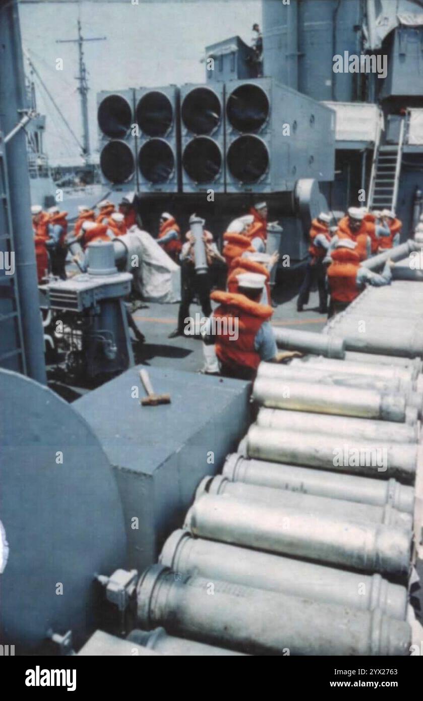 Crewmen on USS Richard B. Anderson transfer empty shell casings to USS ...
