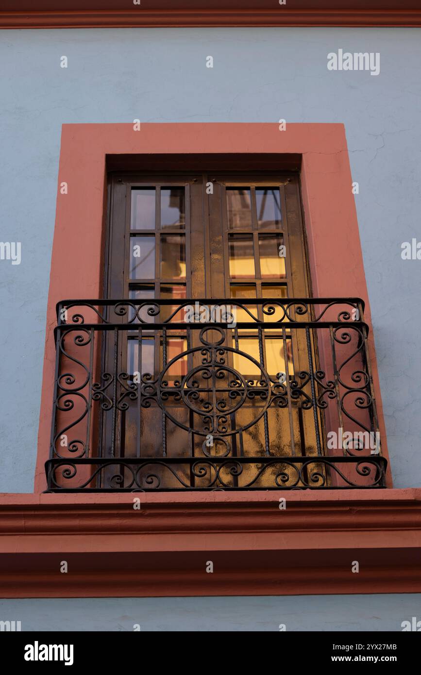Wrought iron balcony and historic window façade in central Jiquilpan ...
