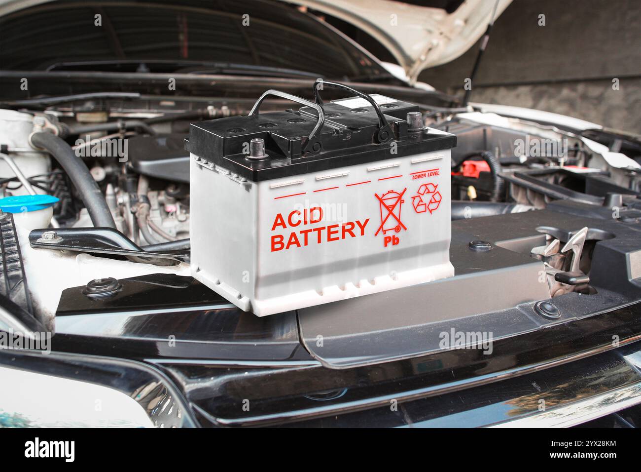 Automotive acid battery on car engine bay , new car battery to replace ...