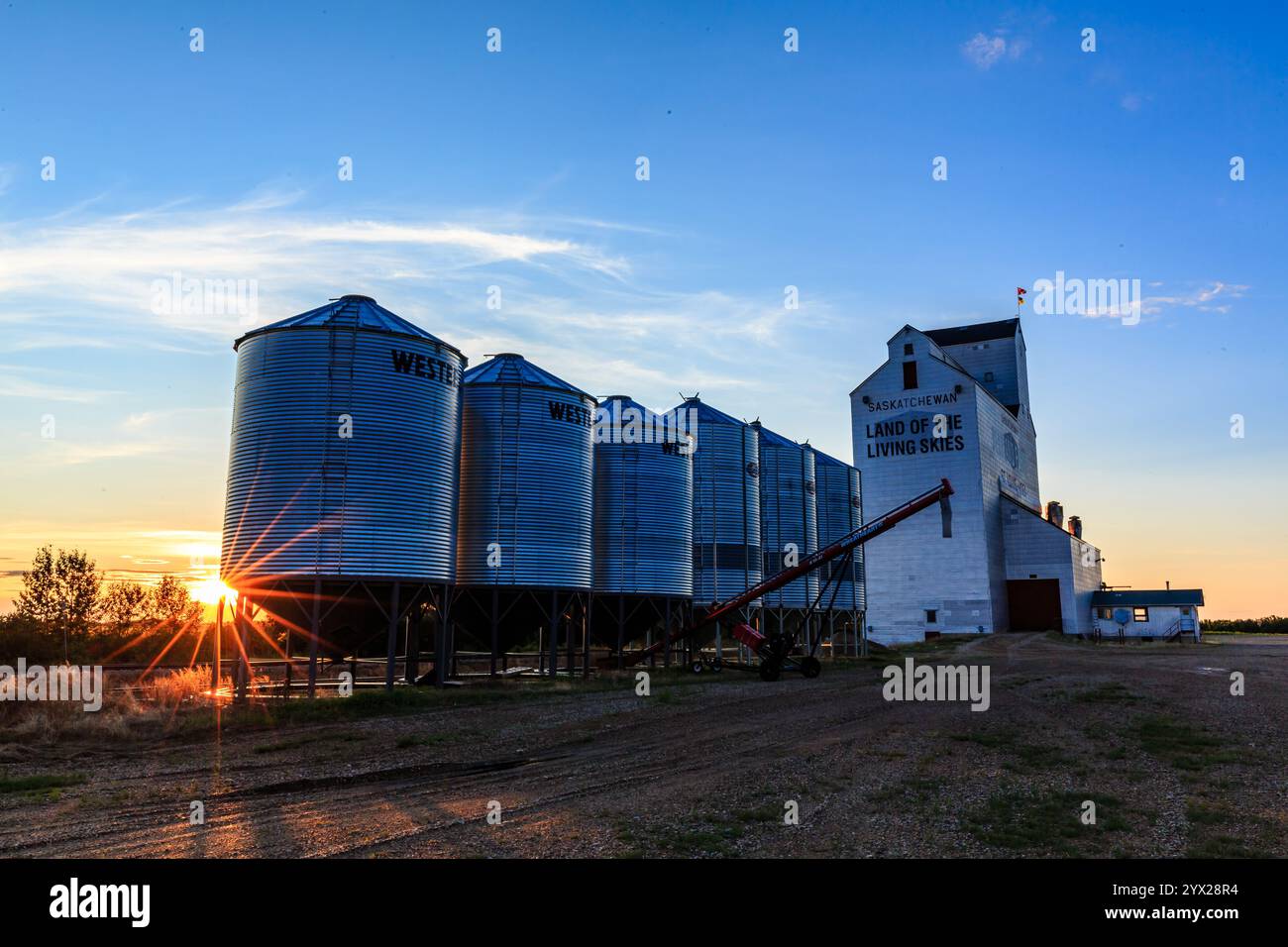 A large grain silo with the words "Land of the Living" written on it ...