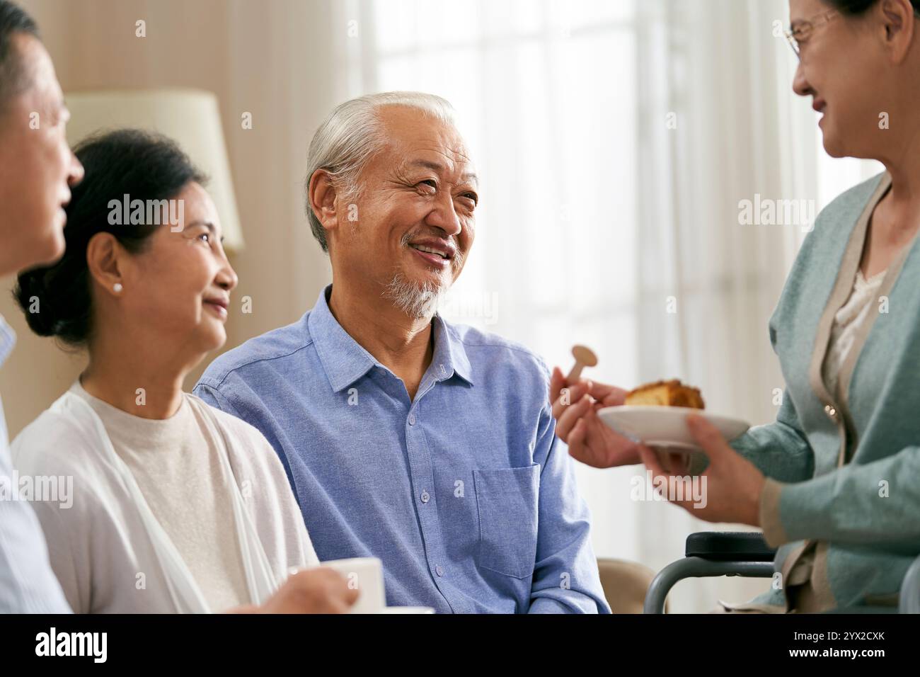 group of happy senior asian gathering at home having a nice chat Stock ...