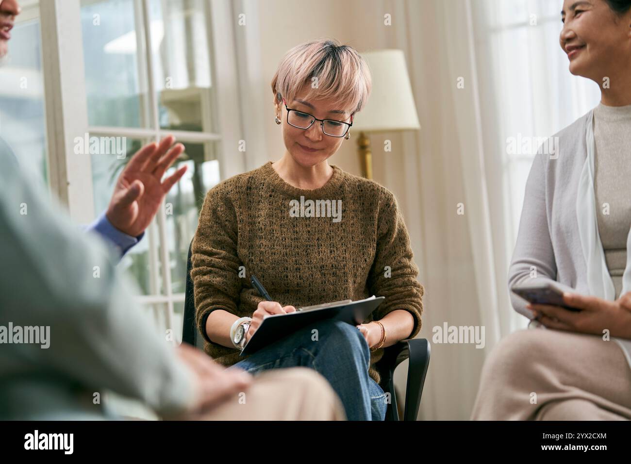 Asian man leading discussion hi-res stock photography and images - Alamy