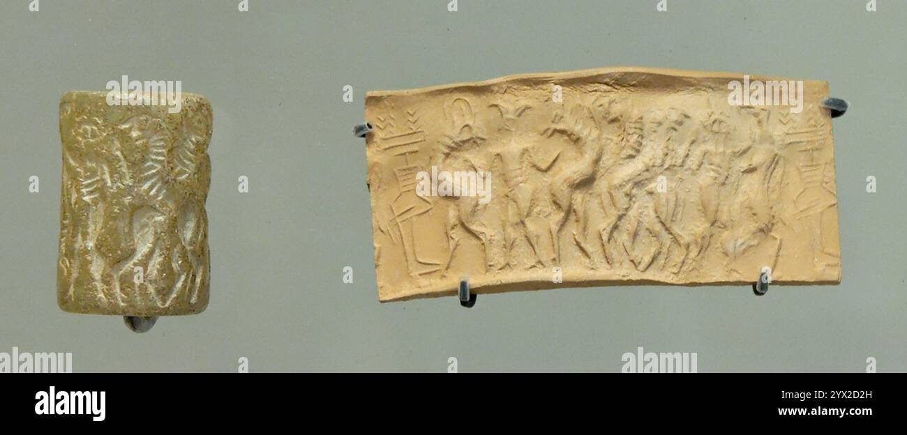 Cylinder seal animals overpowered by gods Stock Photo - Alamy