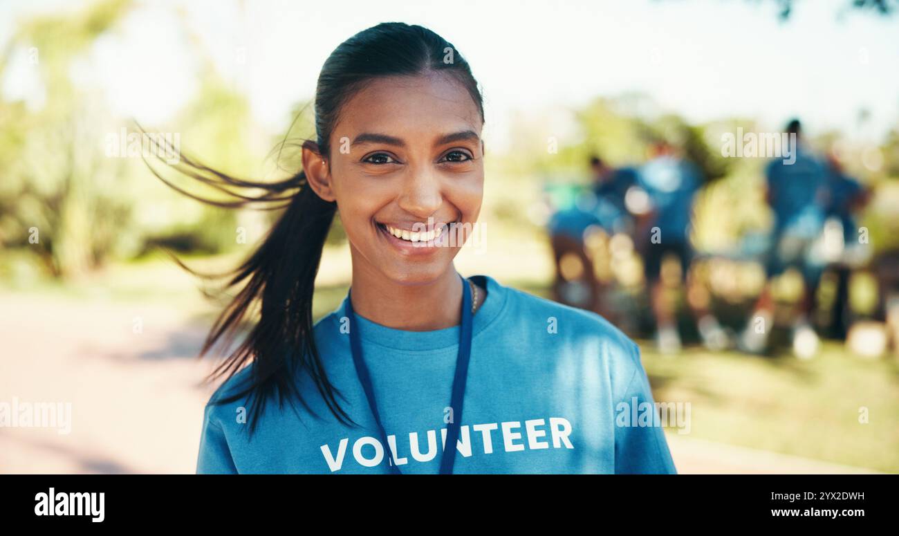 Charity, portrait and wind with woman volunteer outdoor in park for ...