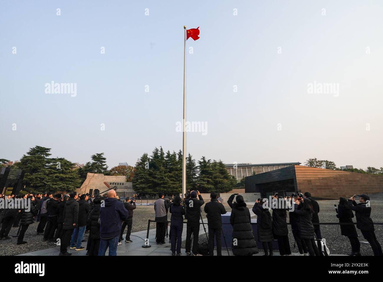 Nanjing, China's Jiangsu Province. 13th Dec, 2024. A flag-raising ...
