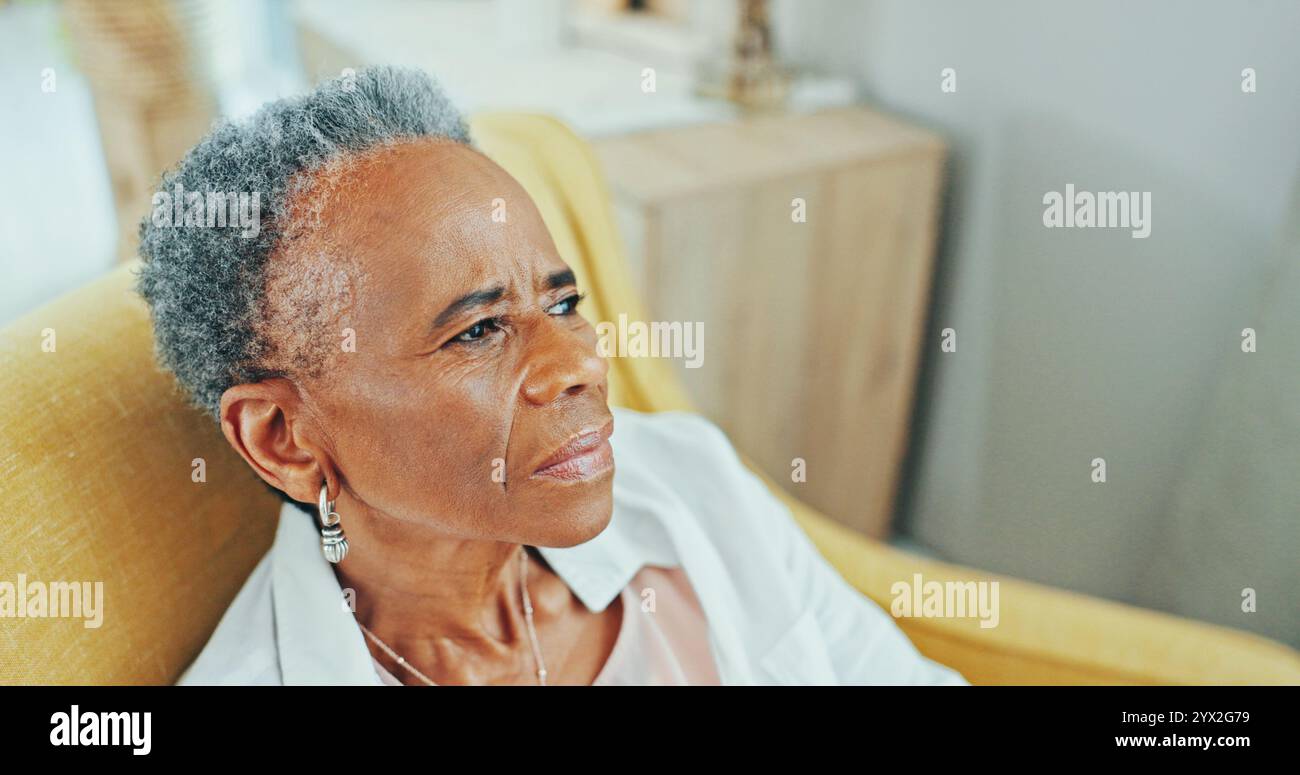 Thinking, sad and elderly black woman in home with depression, nostalgia and reflection in ...