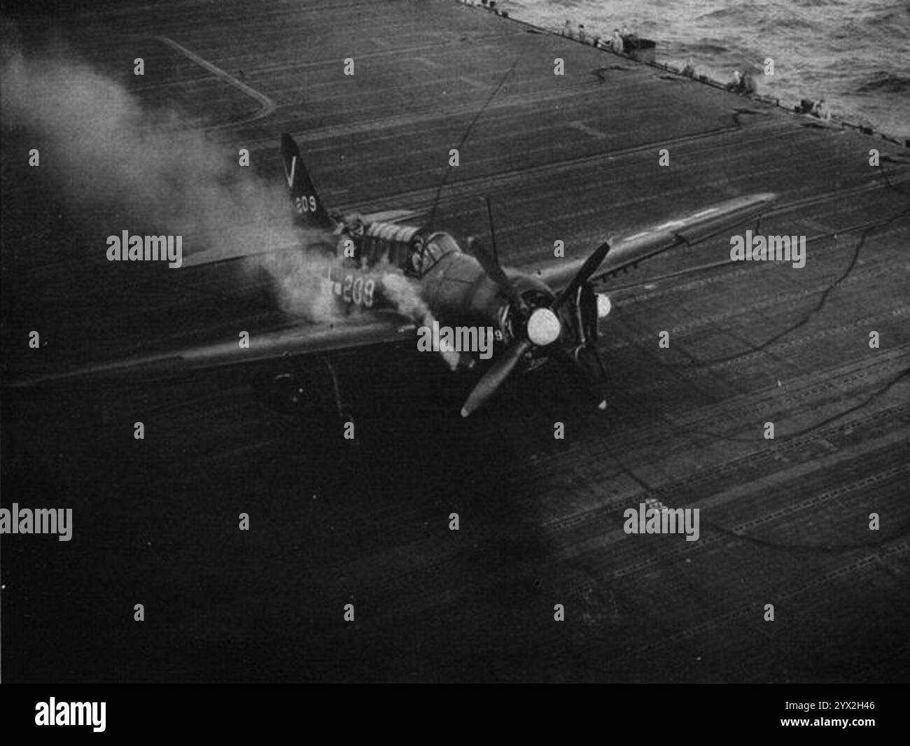 Damaged Curtiss SB2C Helldiver of VB-80 after landing aboard USS ...