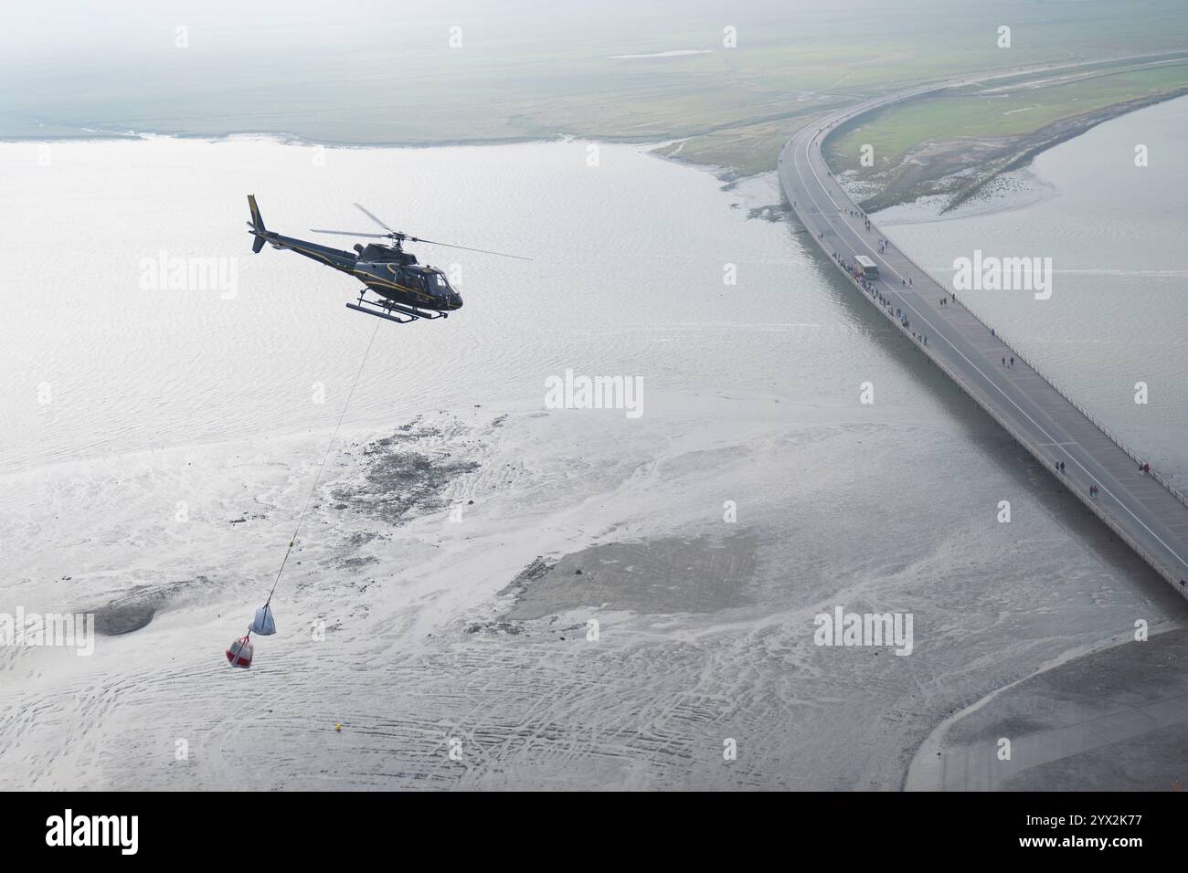 Air transport of materials using a helicopter for a construction site ...
